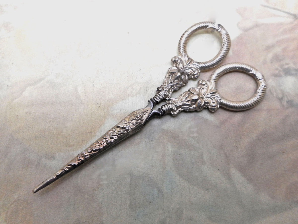 SOLD.....A fine pair of silver handled scissors with blade sheath. c18 ...