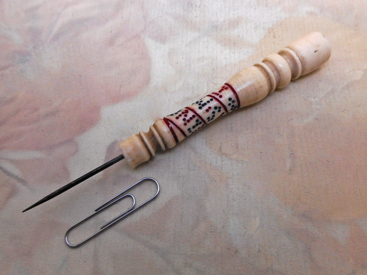 SOLD........A turned bone parchment pricker. Mid 19thc. Lace making ...