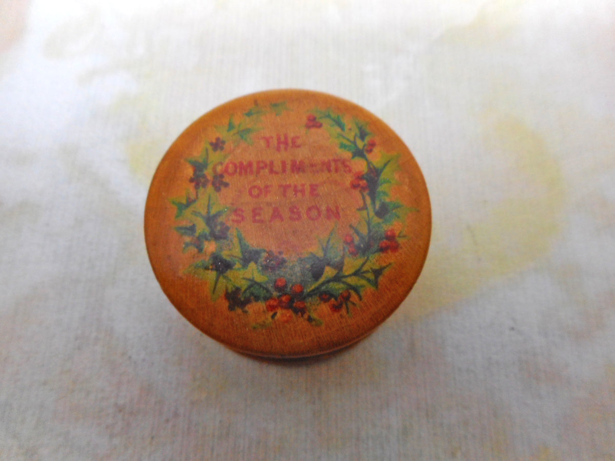 A small Mauchline Ware salve pot. Christmas theme. 'Compliments of the ...