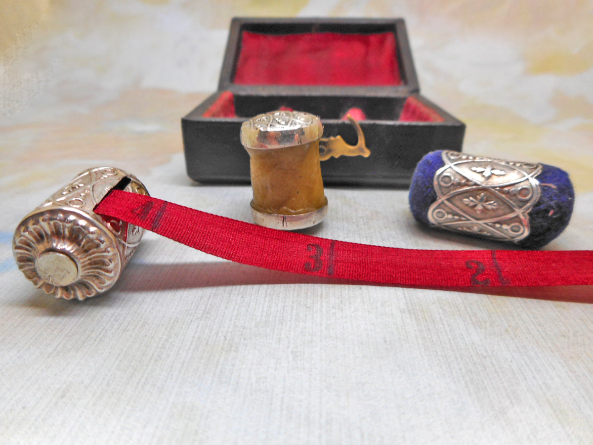 SOLD……A cased sewing set / etui -a silver tape measure, waxer and emer ...
