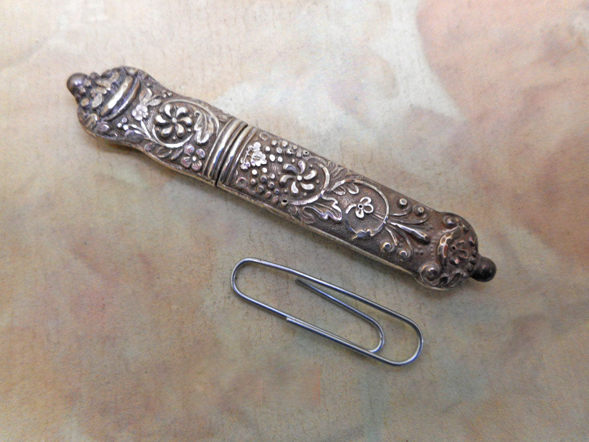 SOLD……..A well worked silver needle case decorated with flowers. c 183 ...