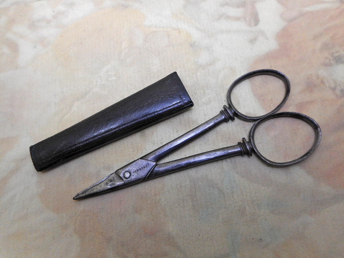SOLD.......Short bladed steel scissors in a leather sheath. Early 19th ...